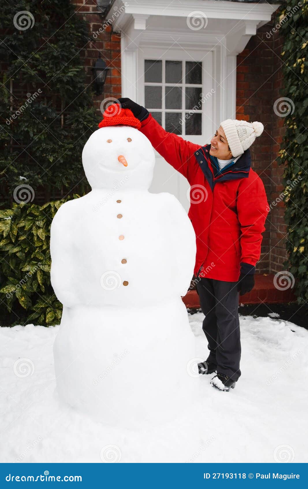 Person building snowman stock photo. Image of adult, cute - 27193118