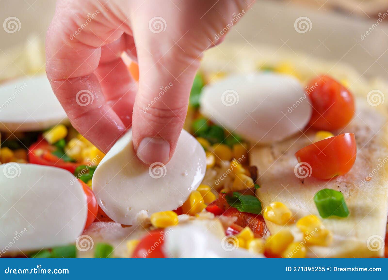 Person Carefully Adding Cheese Slices To Pizza, Process of Making Pizza ...