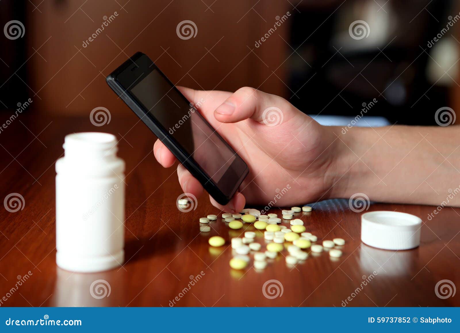 Person with Cellphone and Pills Stock Photo - Image of dial, home: 59737852