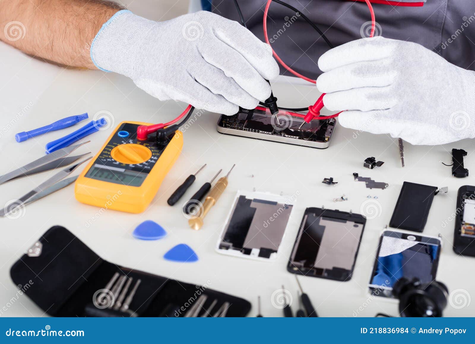 Person Checking Damaged Mobile Phone with Digital Multimeter Stock ...