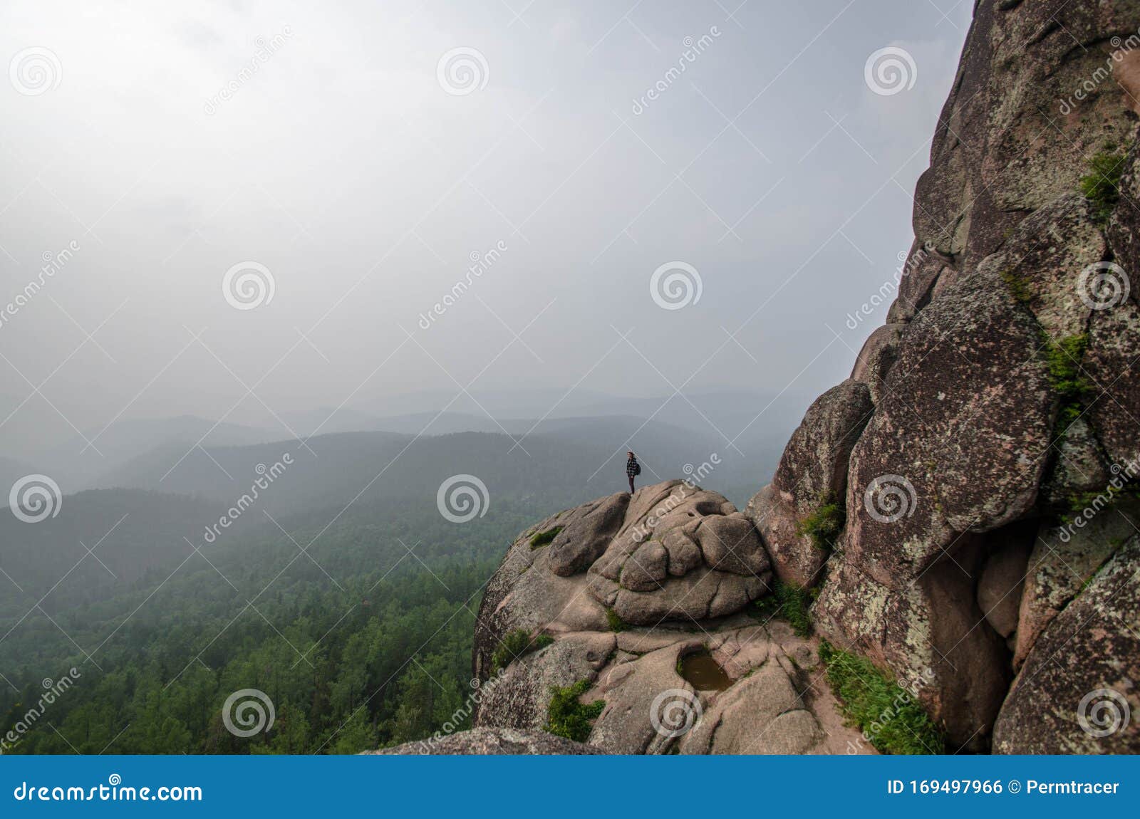 Person on the cliff stock photo. Image of view, cliff - 169497966