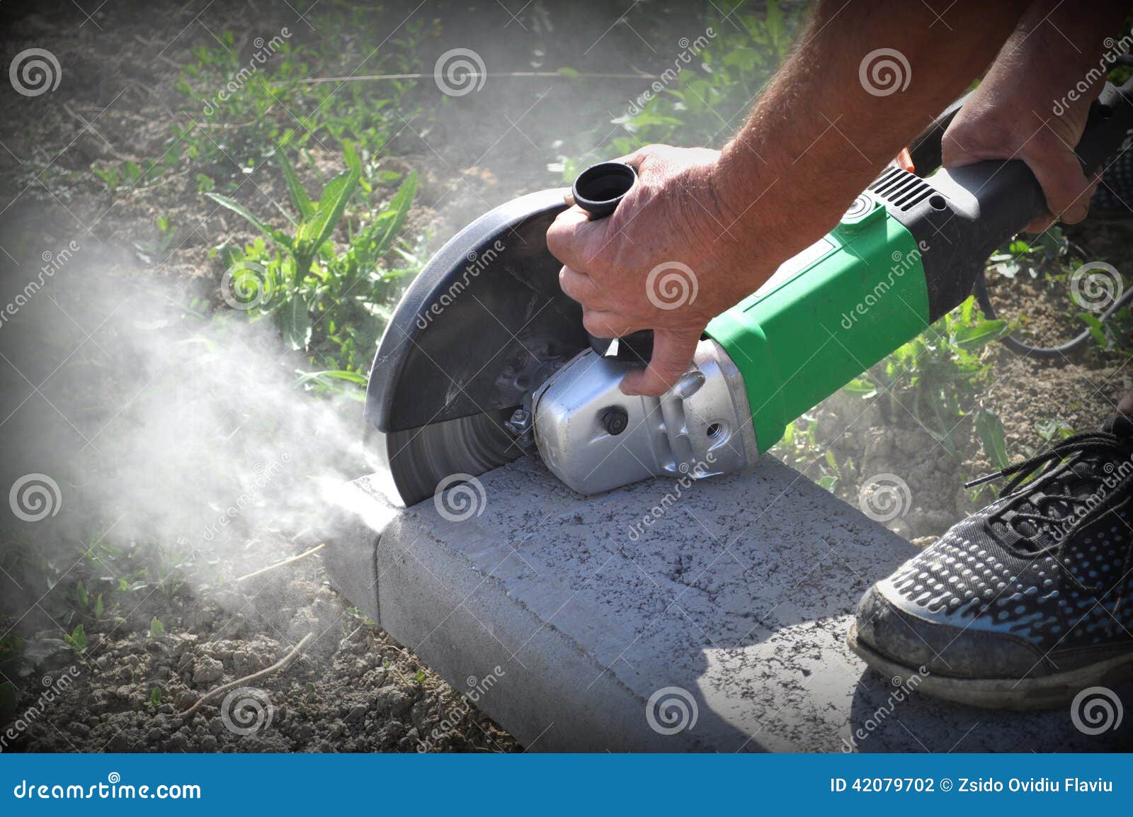 Person Cutting a Piece of Concrete Stock Photo - Image of drilling ...