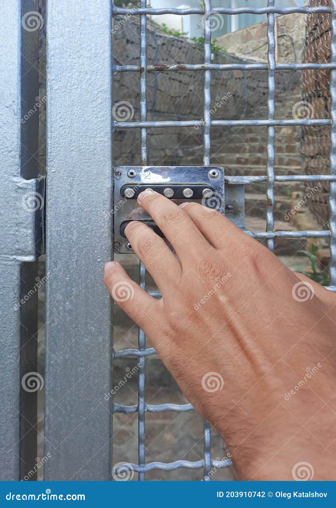 A Person Dials a Code on a Digital Lock. Breaking the Combination Lock ...