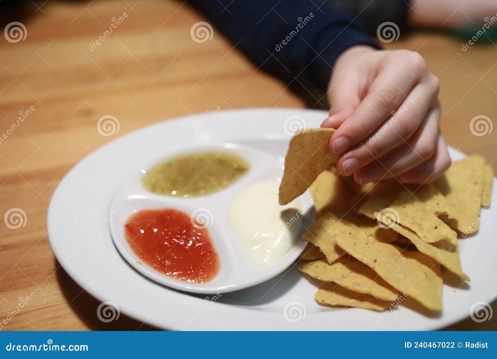 Person Dipping Nachos in Sauce Stock Photo - Image of junk, nacho ...