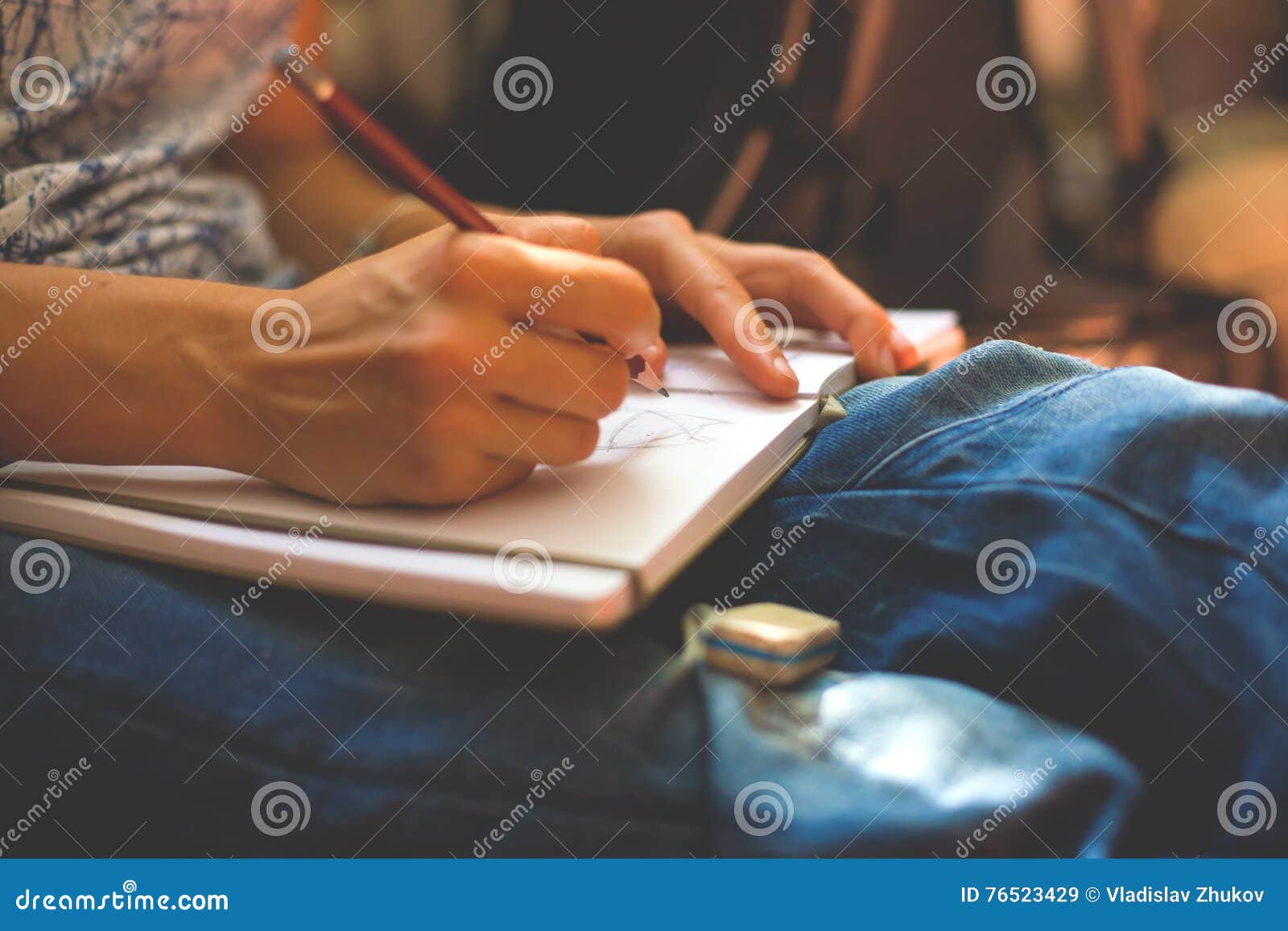 A Person Draws with a Pencil in a Notebook. Stock Image - Image of ...
