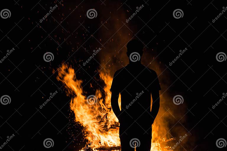 Person before a fire. stock image. Image of orange, dark - 282595925