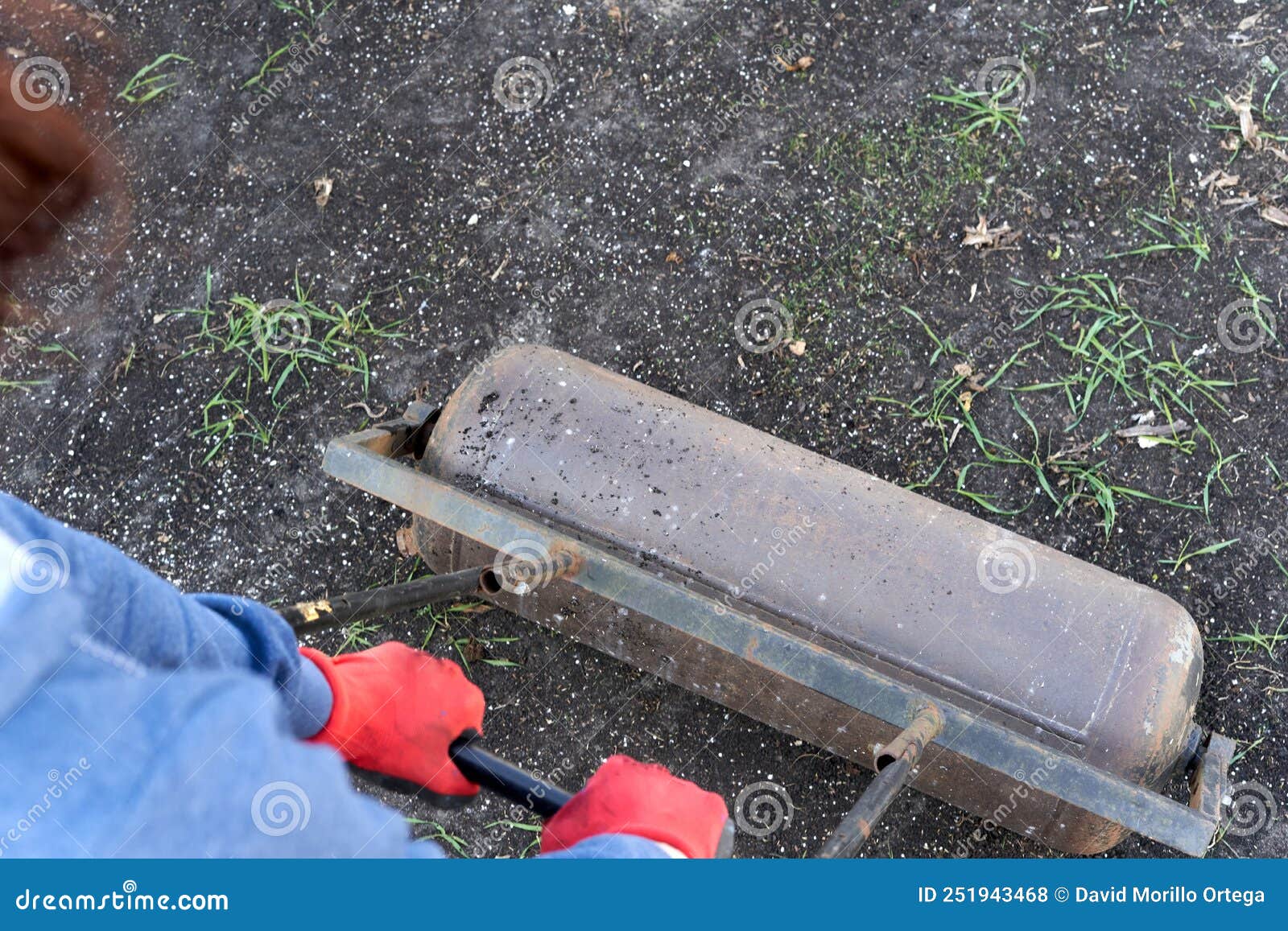 Person Flattening the Soil in the Traditional Way Stock Photo - Image ...