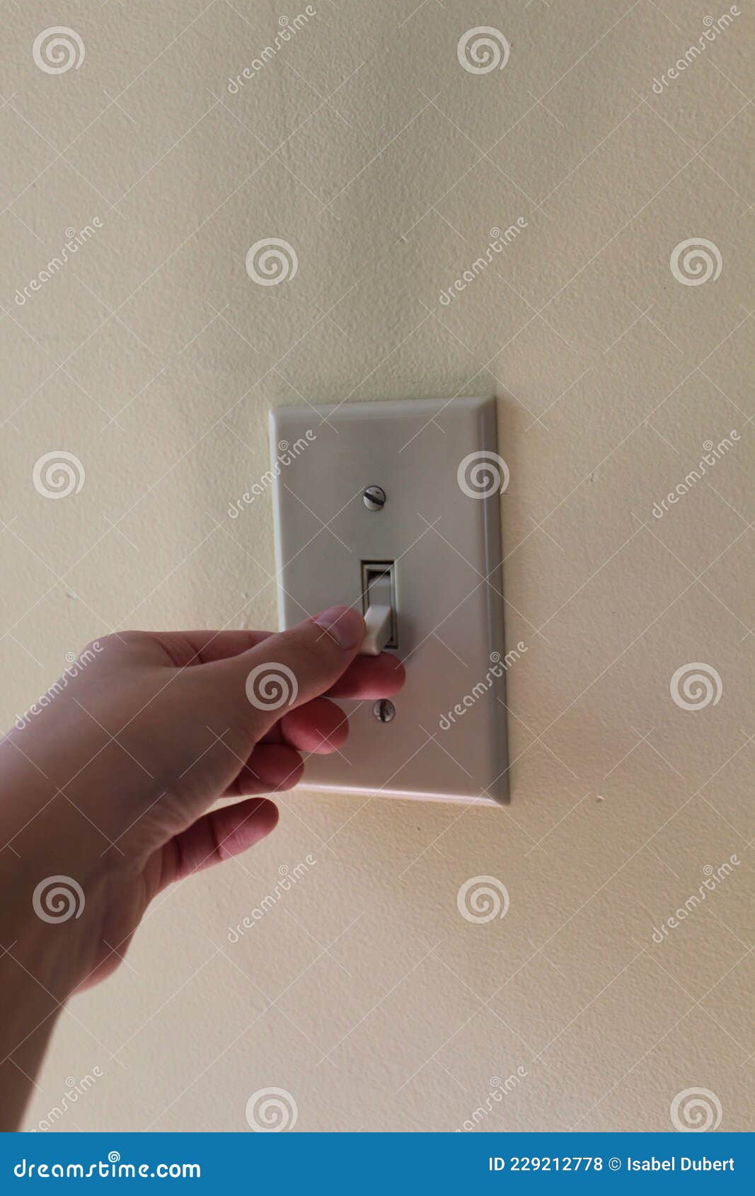 Person Flipping Light Switch on a Wall Stock Photo - Image of ...