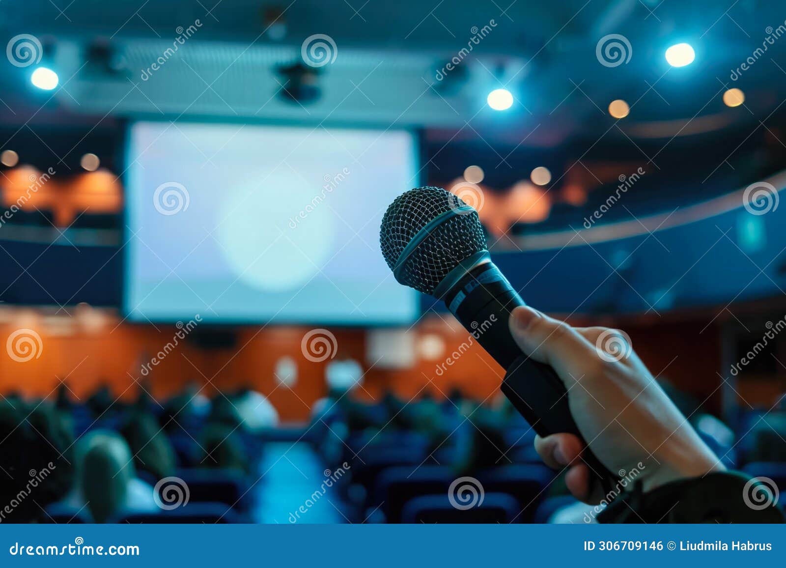 Person Giving a Speech at a Conference with a Microphone and a ...