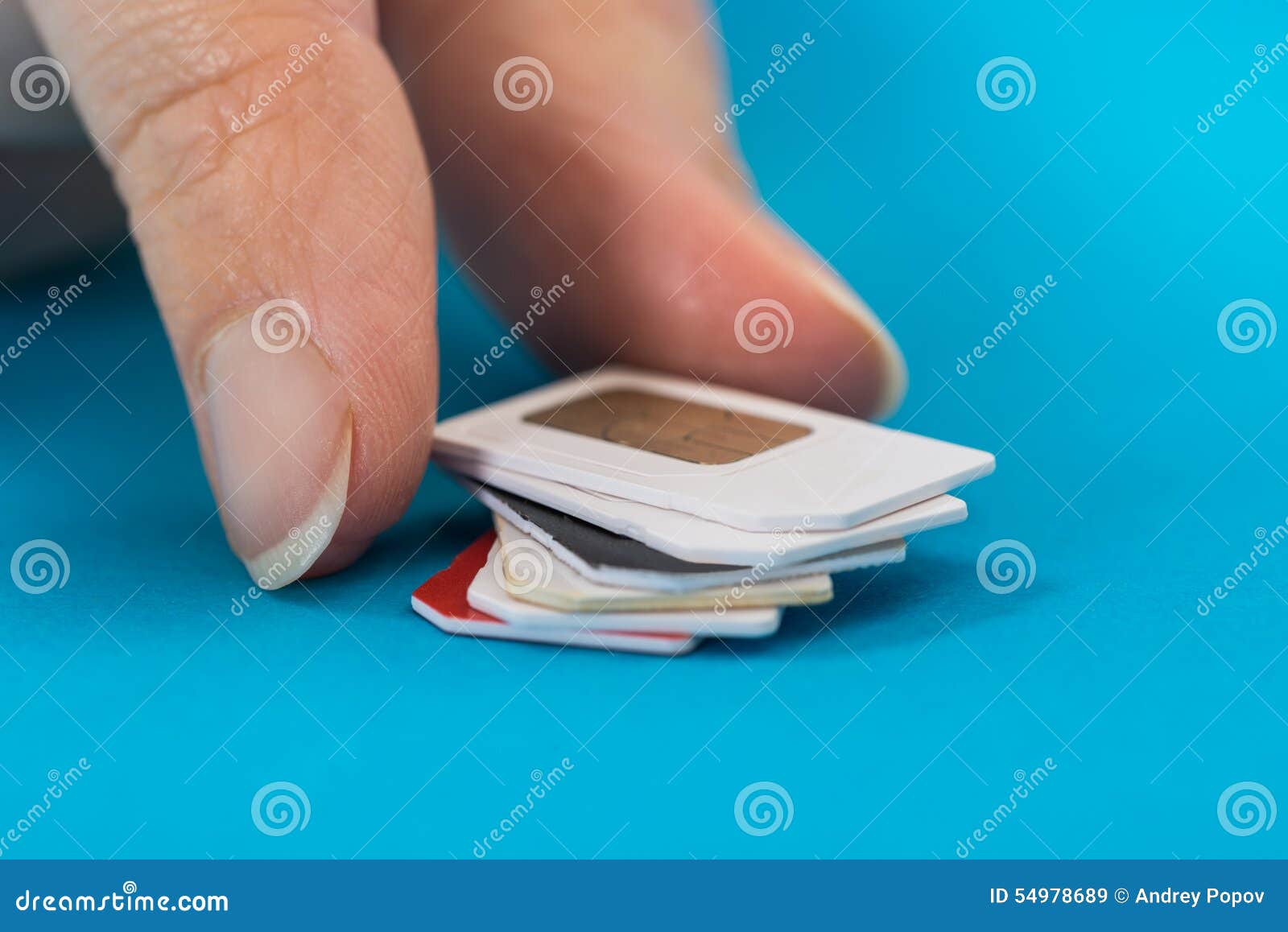 Person Hand Placing Stack of Sim Card Stock Image - Image of hand ...