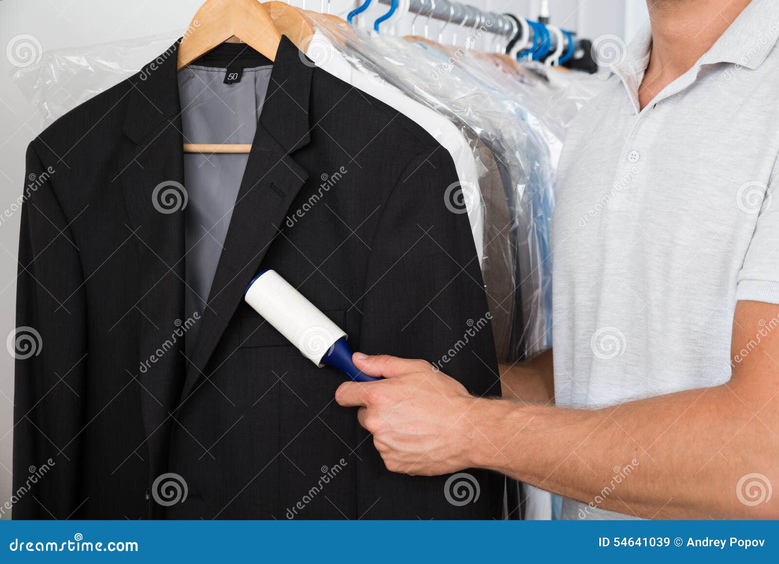 Person Hand Removing Dust with Lint Roller Stock Image - Image of ...