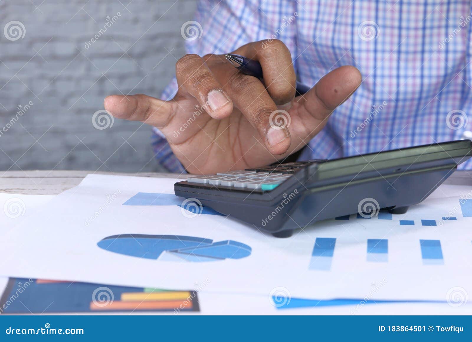 Person Hand Using Calculator and Analyzing Charts Stock Image - Image ...