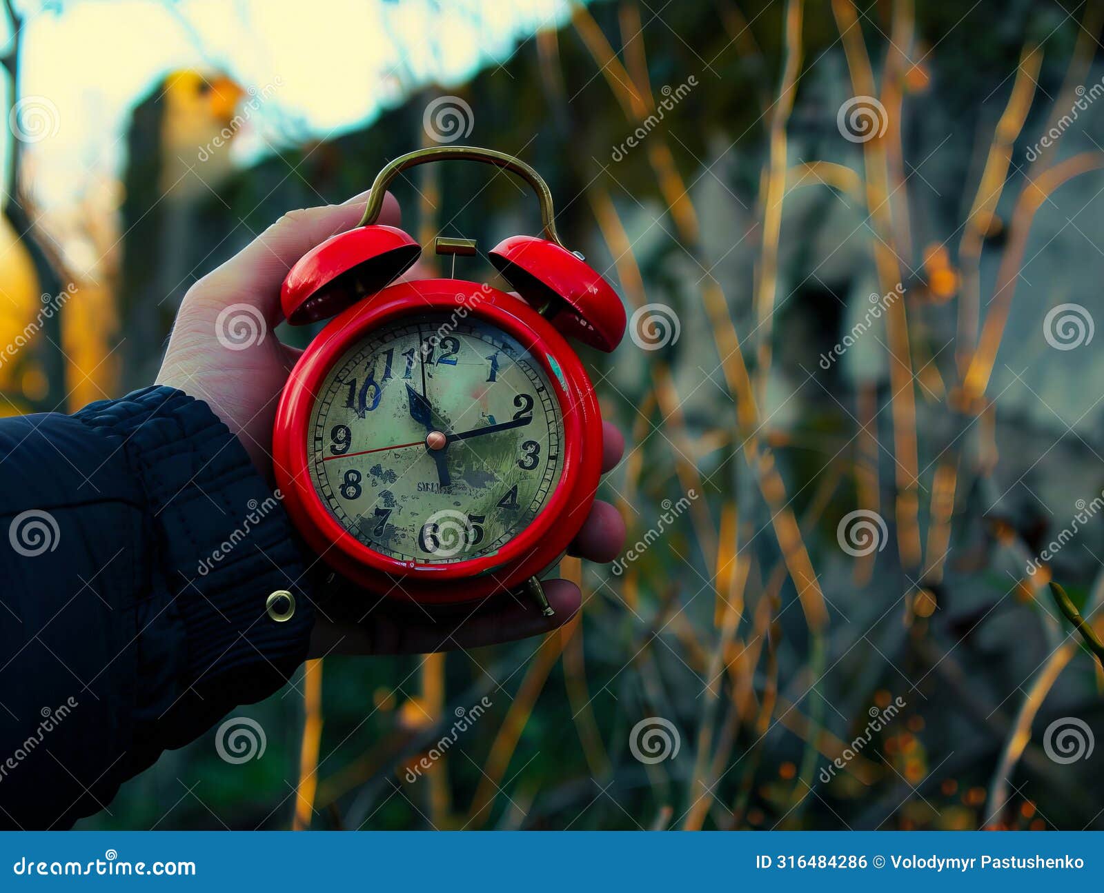 A Person Holding an Alarm Clock in Their Hand Stock Photo - Image of ...