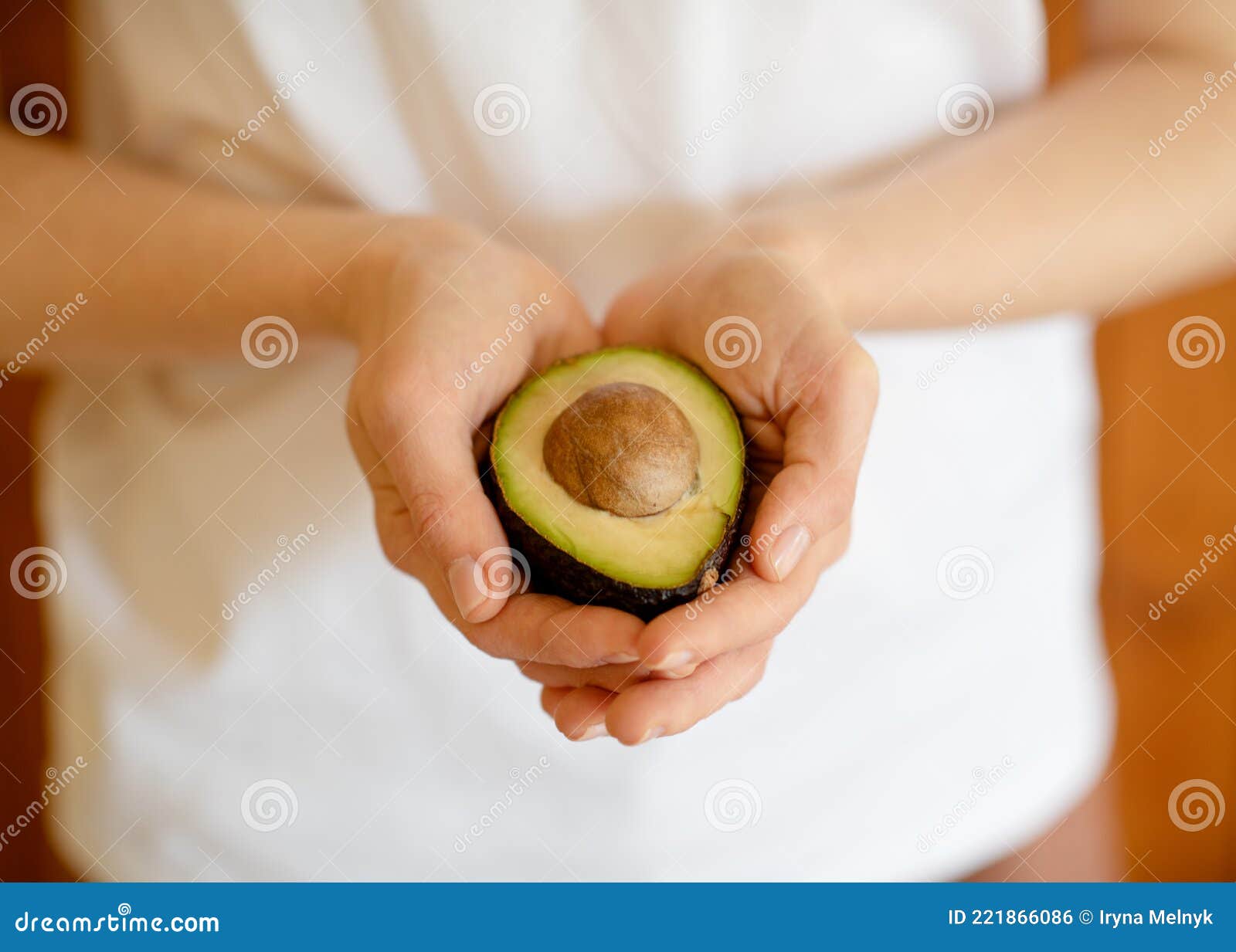 Person holding an avocado stock photo. Image of health - 221866086