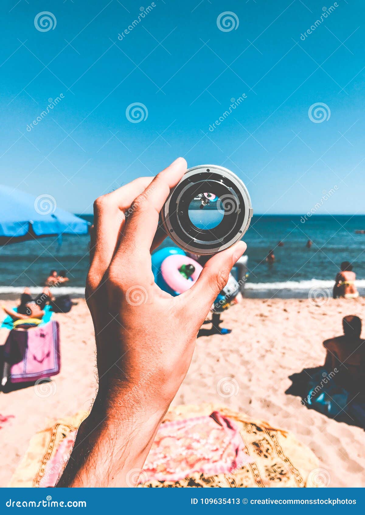 Person Holding Camera Lens Picture. Image: 109635413