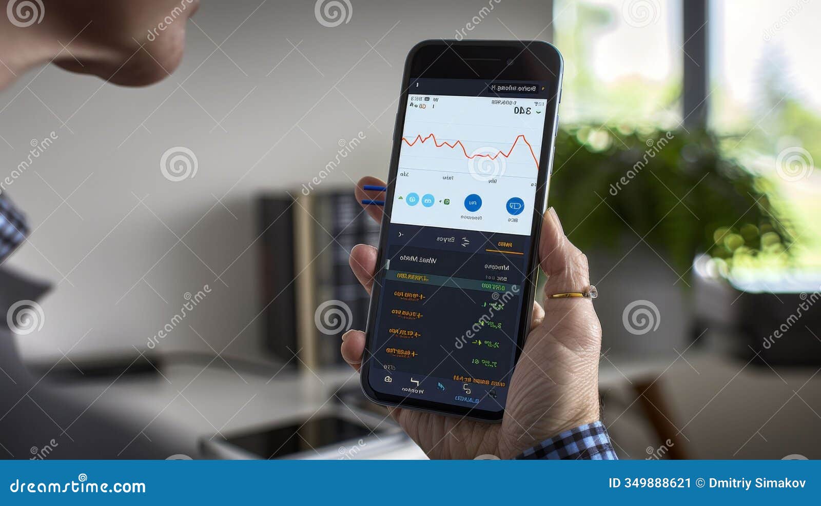 A Person is Holding a Cell Phone that is Displaying a Graph Stock Image ...