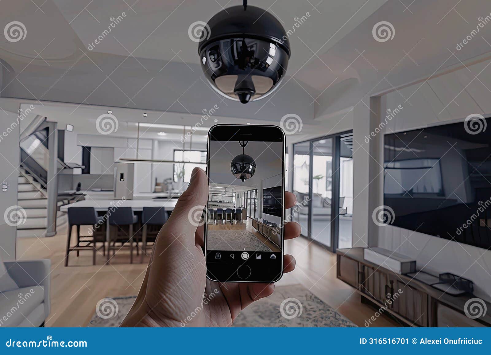 Person Holding Cell Phone in Front of Security Camera in Living Room ...