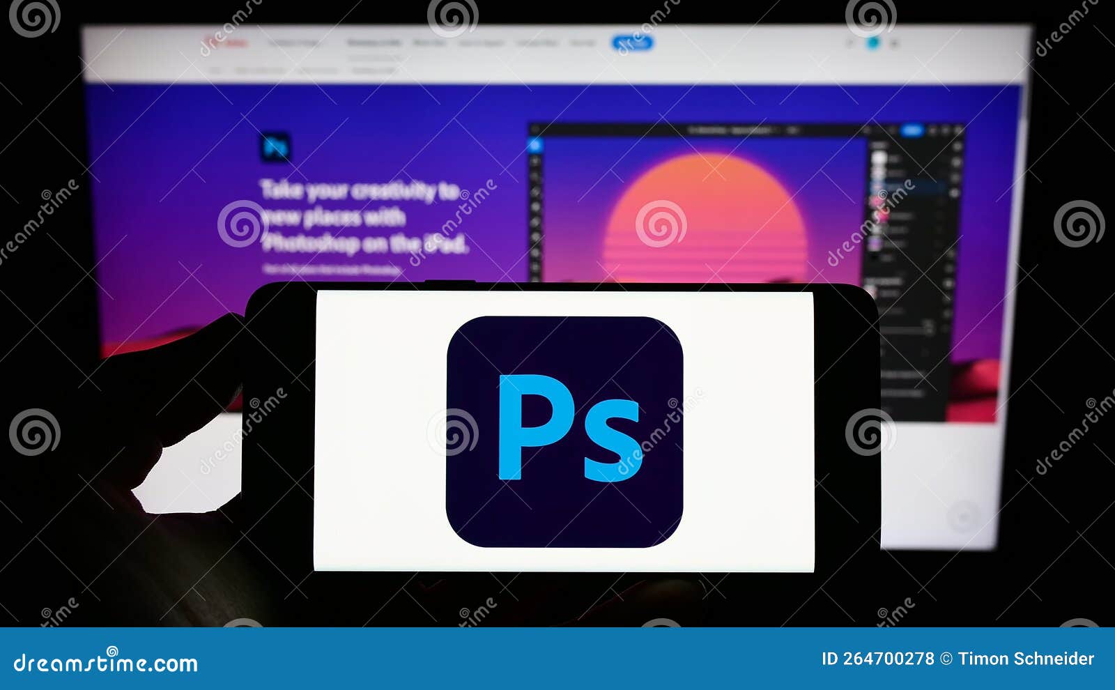 Person Holding Cellphone with Logo of Graphics Editor Software Adobe ...