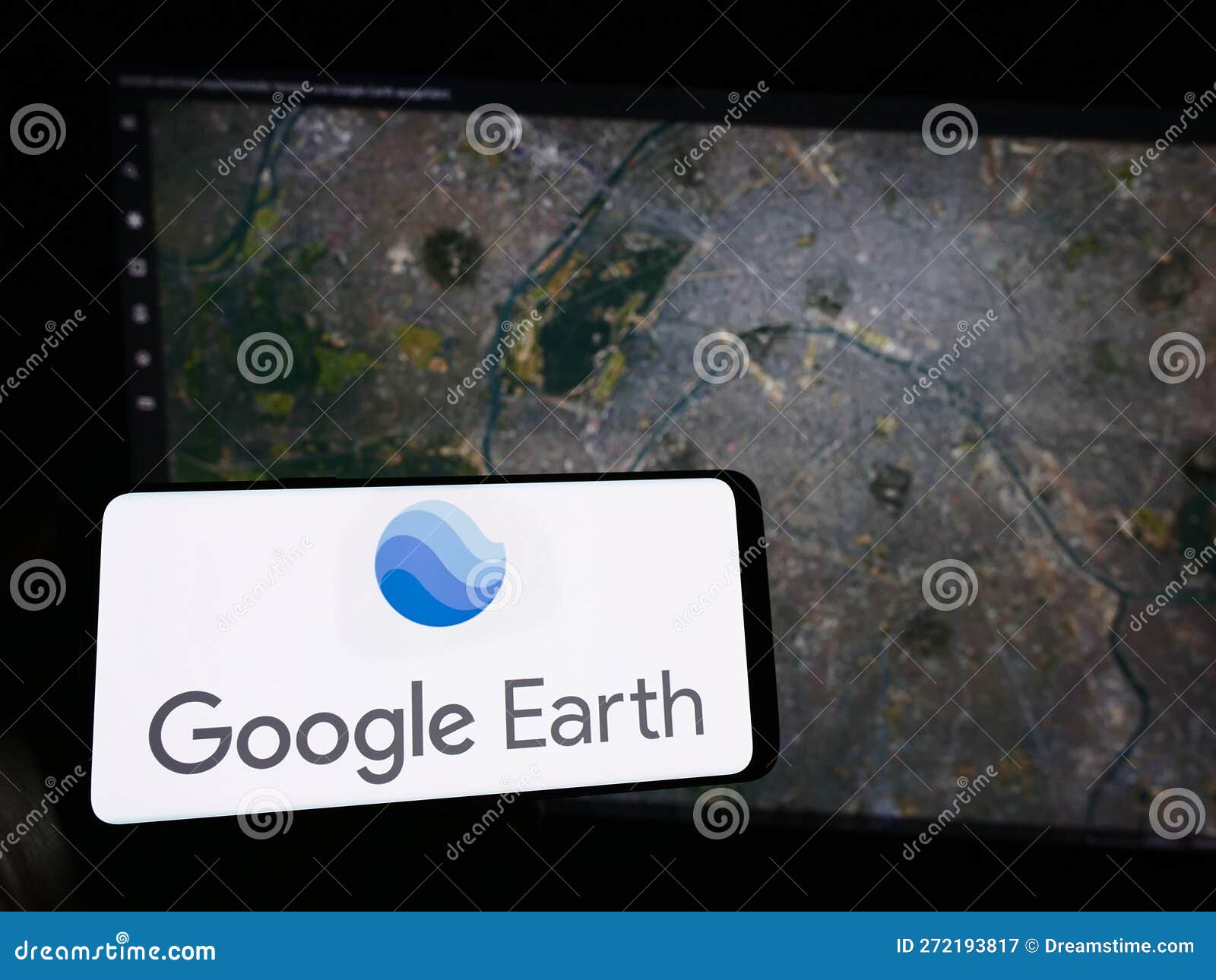 Person Holding Cellphone with Logo of Satellite Imagery Software Google ...