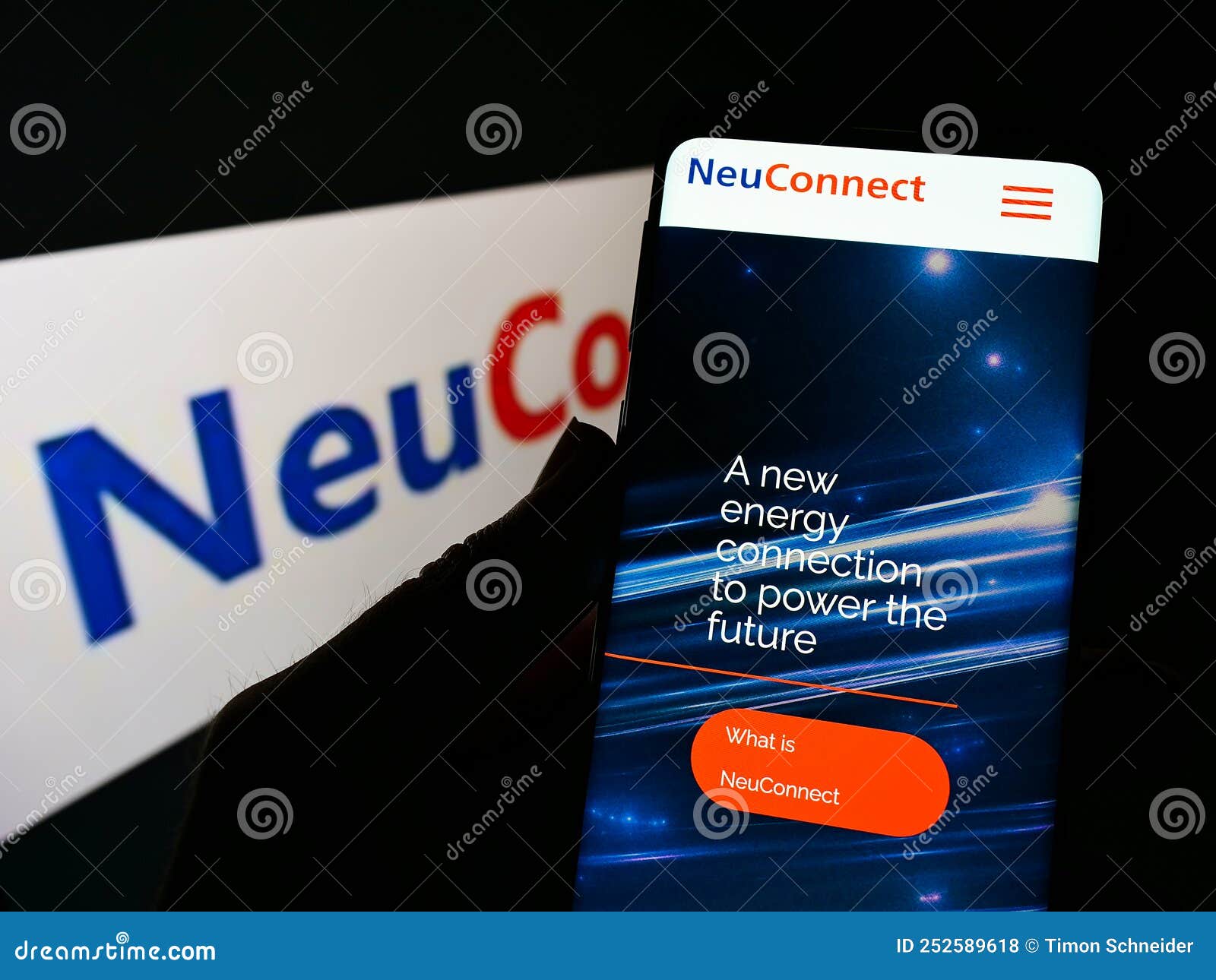 Person Holding Cellphone with Website of Power Cable Project NeuConnect ...