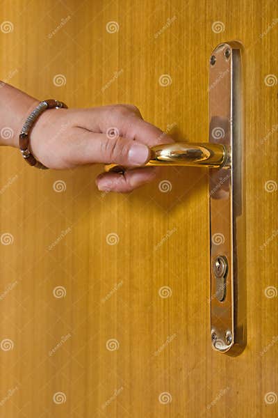 Person holding door handle stock photo. Image of opening - 10937514