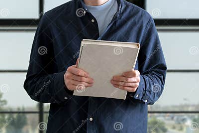 A Person Holding and Giving a Book, Share a Present and Knowledge Stock ...