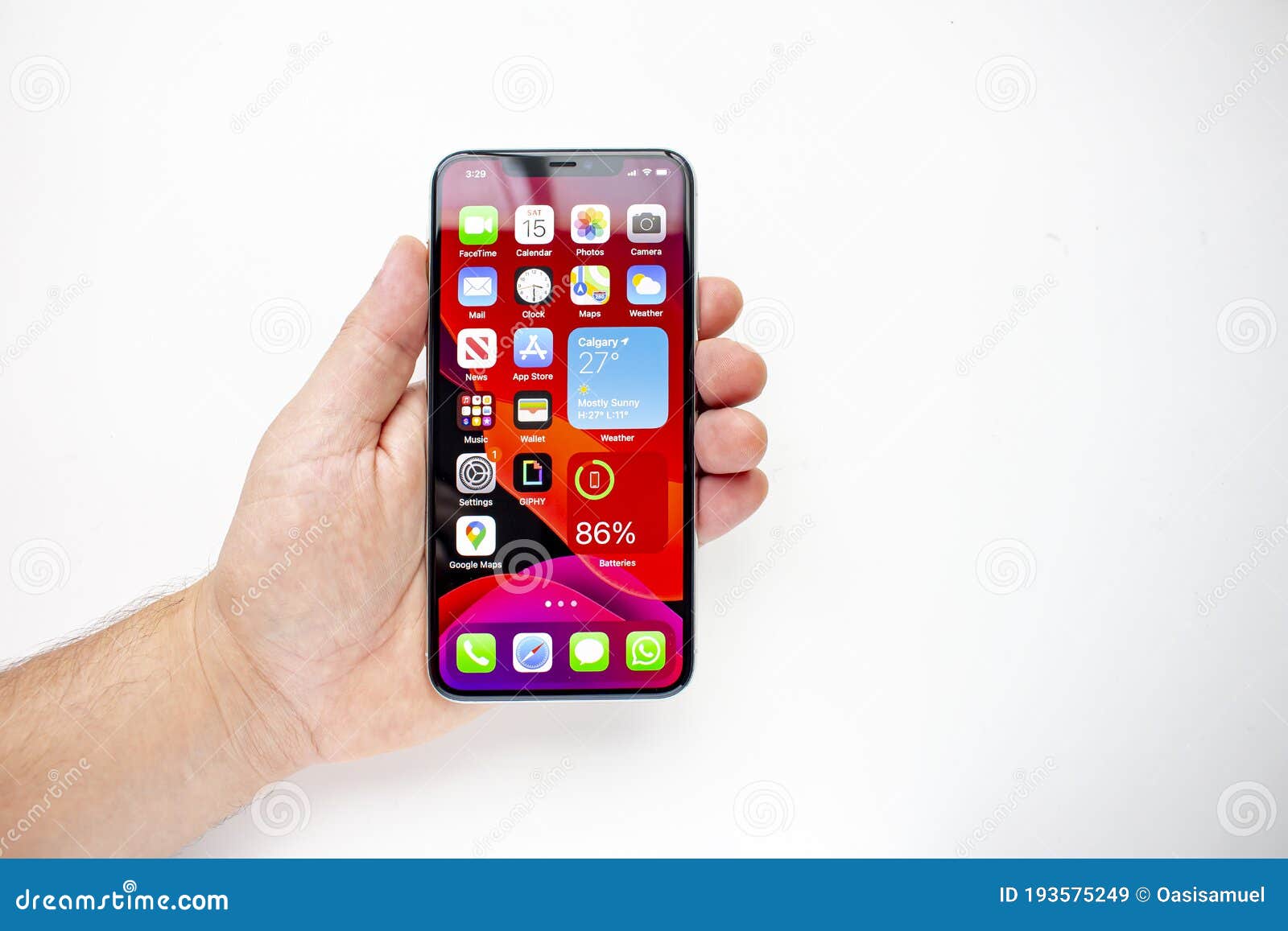 A Person Holding an IPhone 11 Pro Max with the New IOS14 Home Screen ...