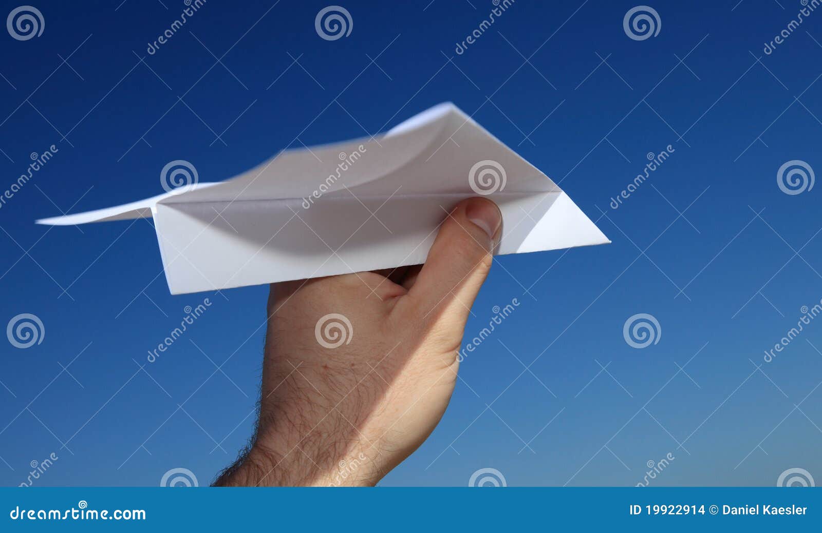 Person holding paper plane stock photo. Image of flying - 19922914