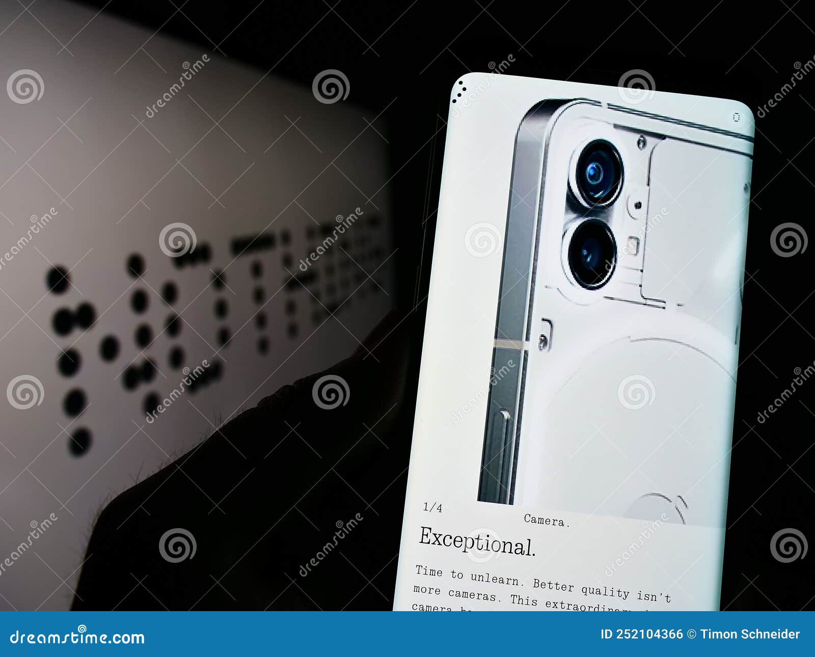 Person Holding Smartphone with Webpage of British Company Nothing ...