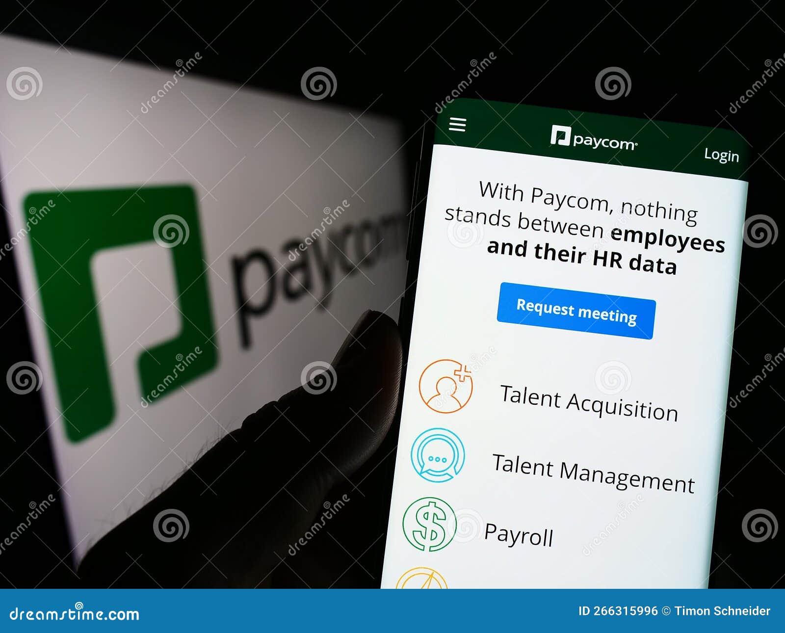 Person Holding Smartphone with Webpage of Payroll Technology Company ...