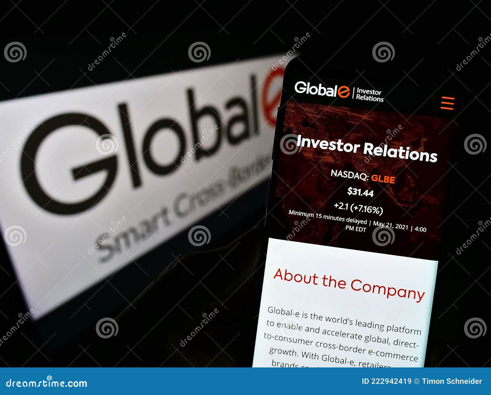 Person Holding Smartphone with Website of E-commerce Platform Global-e ...