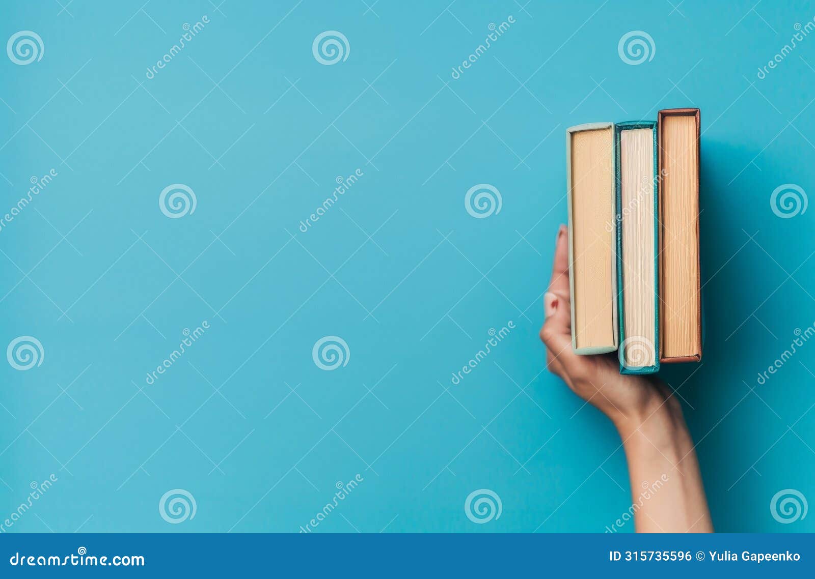 Person Holding a Stack of Books Stock Photo - Image of literary, person ...