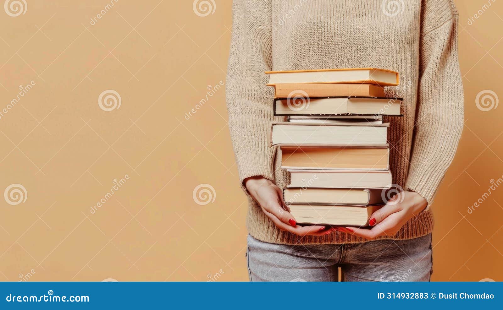 A Person is Holding a Stack of Books in Their Hands Stock Image - Image ...