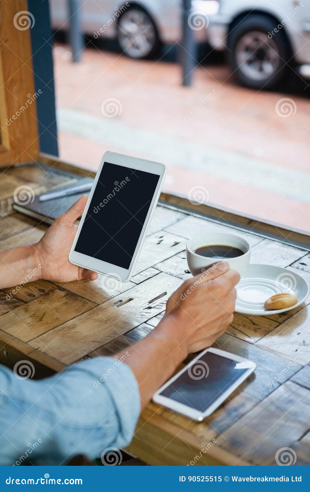 Person Holding Tablet Computer by Coffee Cup at Table Stock Image ...