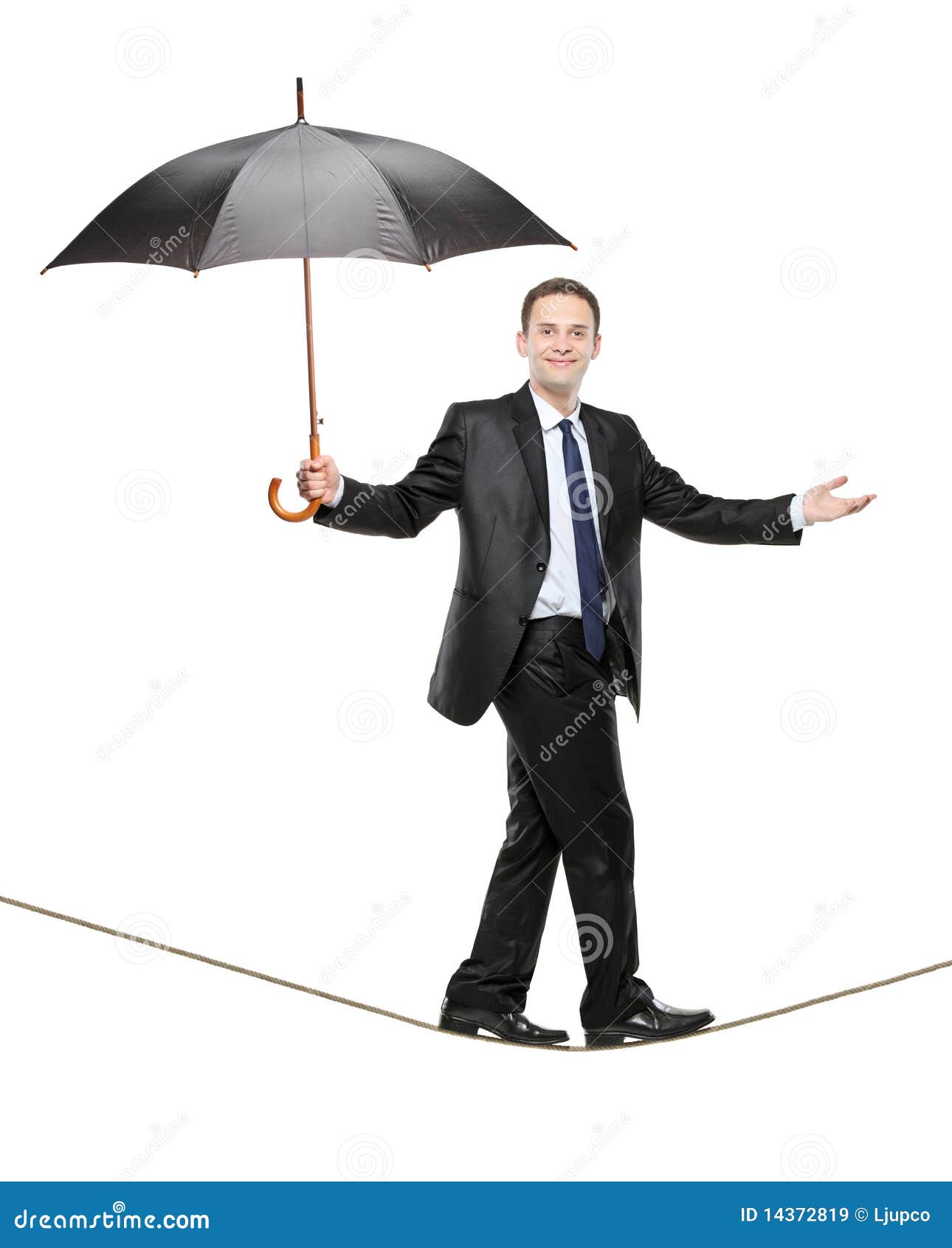 A Person Holding an Umbrella and Walking on a Rope Stock Image - Image ...