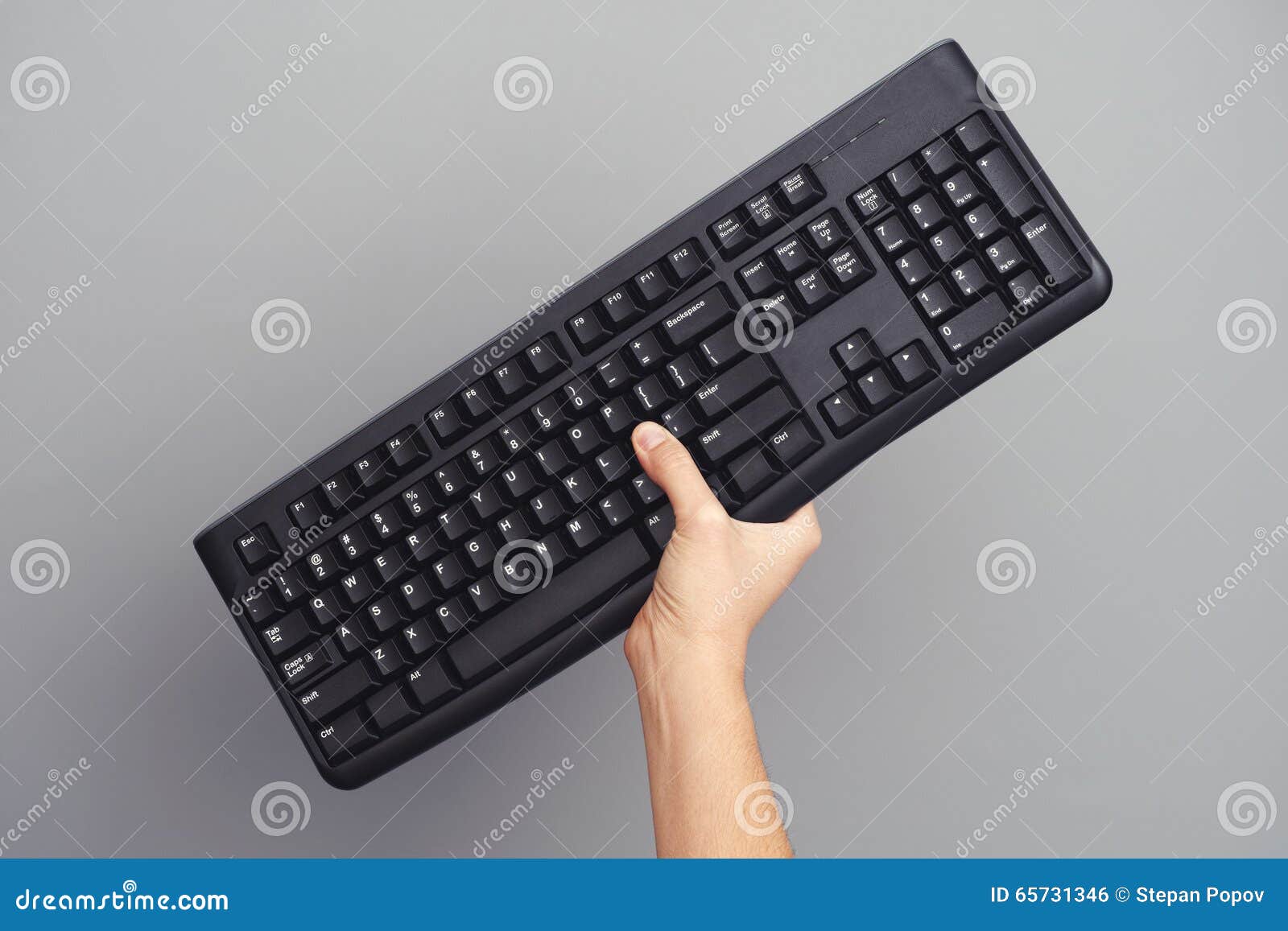 Person Holds Black Wireless Keyboard in Her Hand Stock Photo - Image of ...