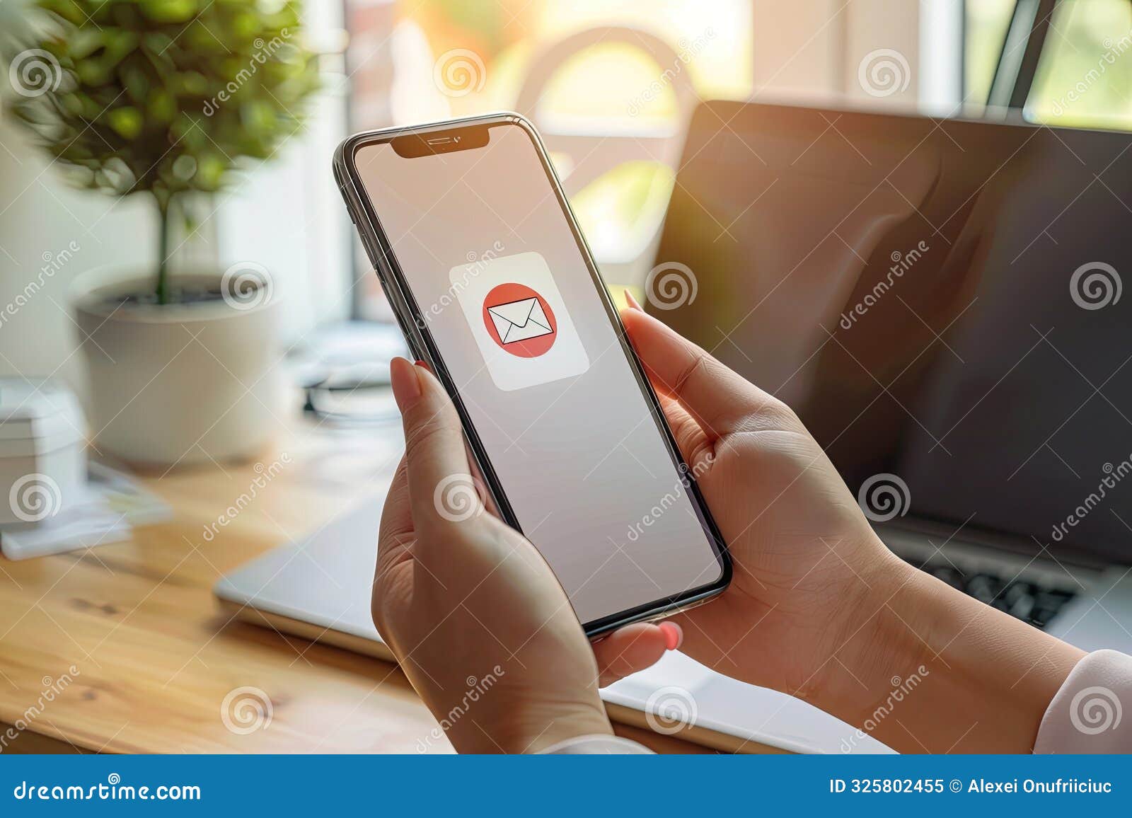 A Person Holds a Cell Phone with Email Icon on Screen Stock ...