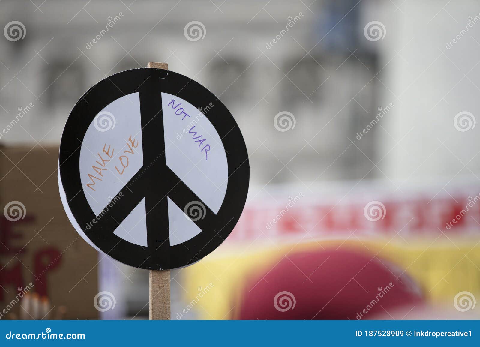 A Person Holds a Peace Sign Banner at a Protest Stock Image - Image of ...