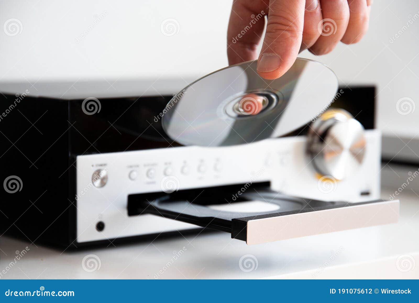 Person Inserting a CD into a Stereo System Stock Photo - Image of ...