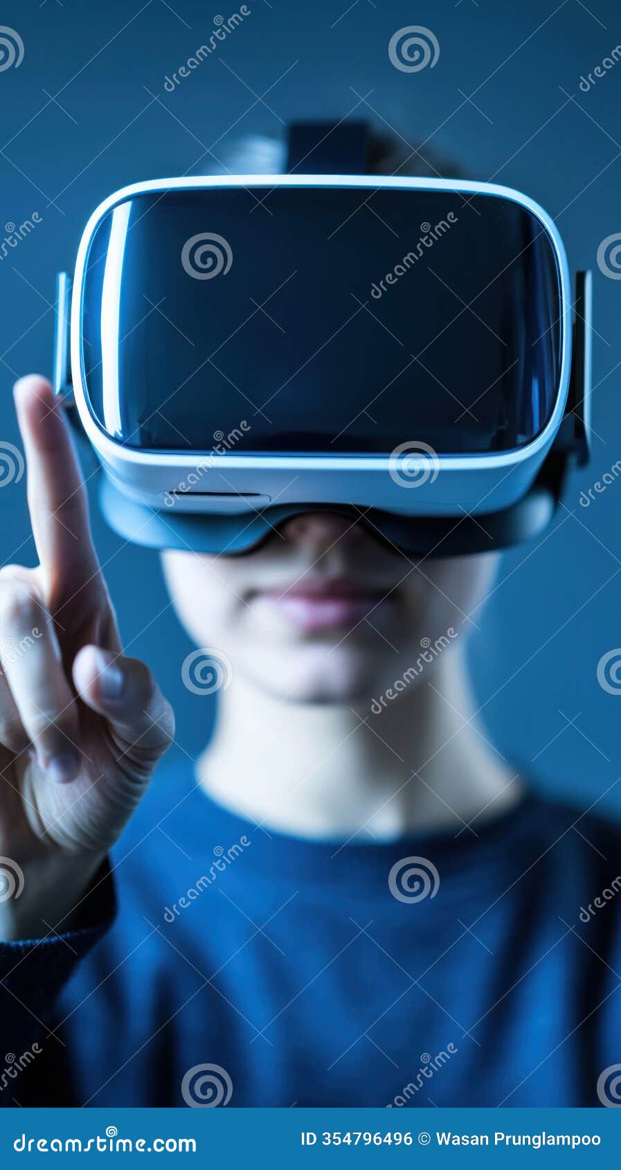 A Person Interacting with Virtual Reality Using a Headset in a ...