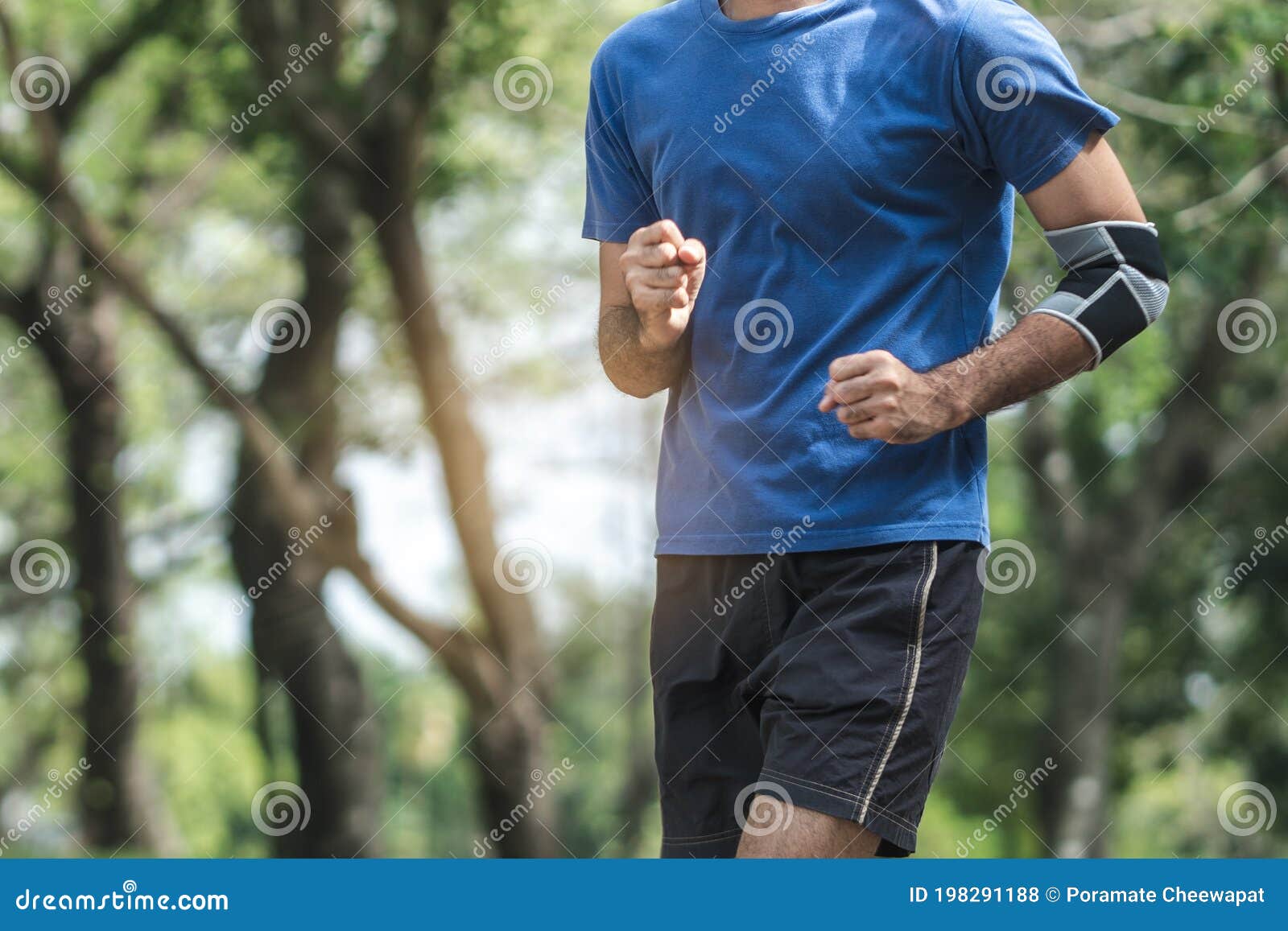 Person jogging in the park stock photo. Image of jogger - 198291188