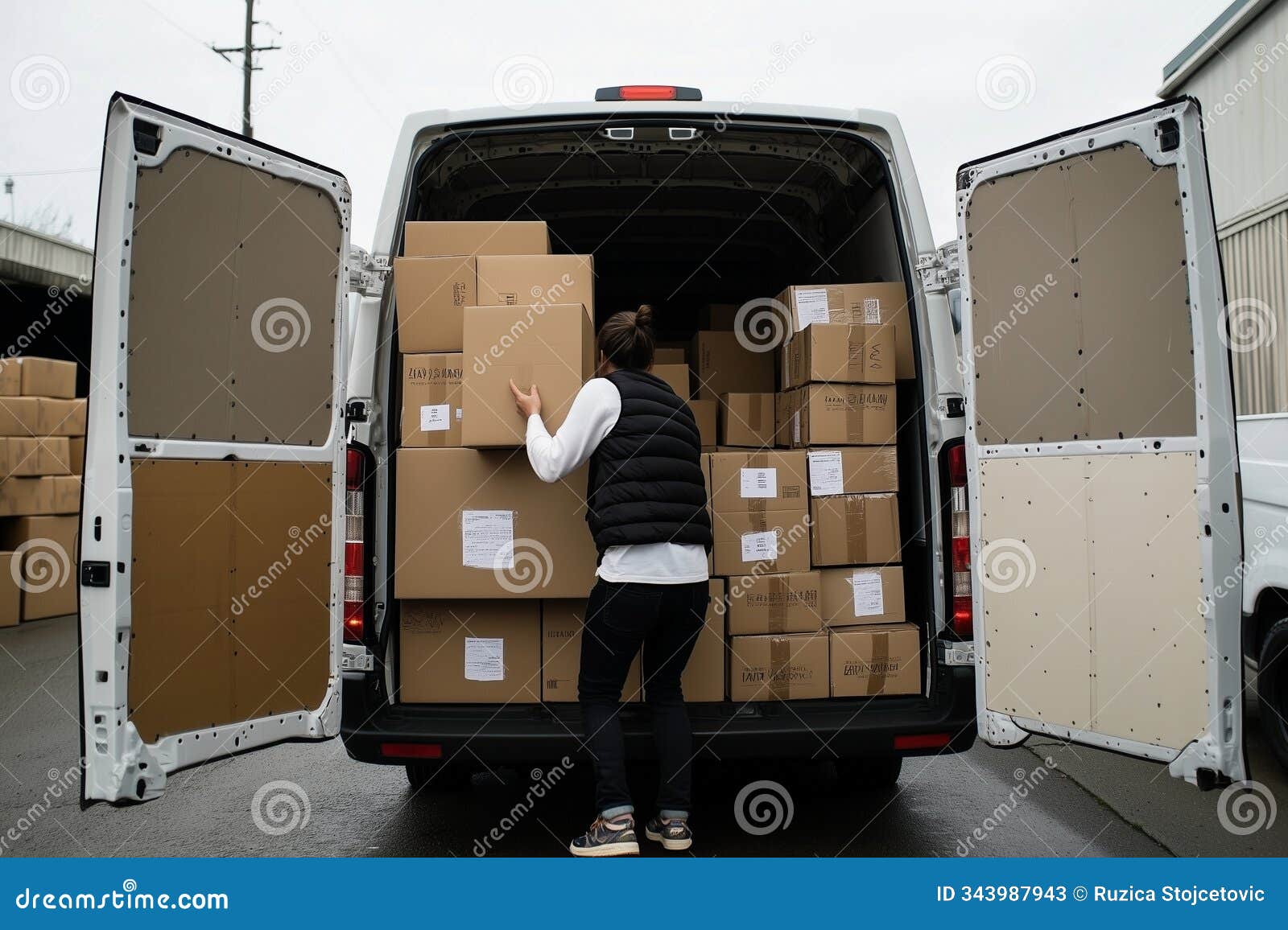 A Person is Loading Boxes into the Back of an Open Van Ai Photo Stock ...