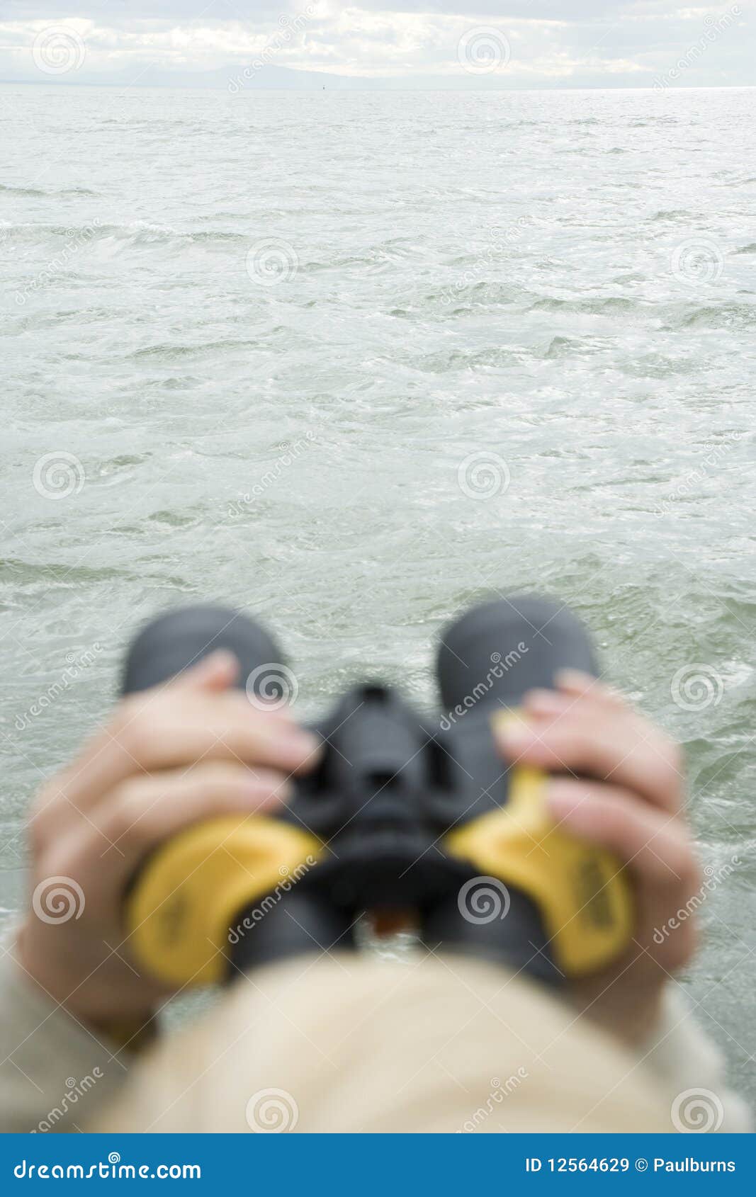 Person Looking Across Water through Binoculars Stock Image - Image of ...