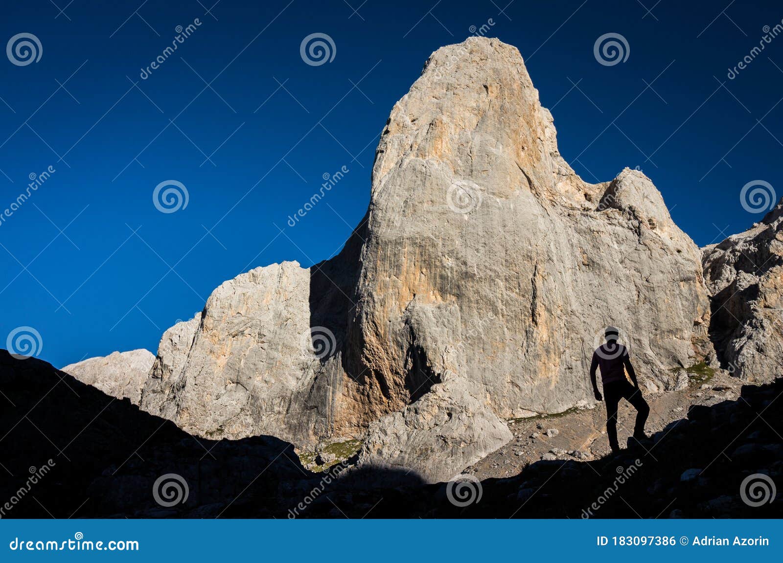 Person Looking at a Mountain from the Ground Stock Photo - Image of ...