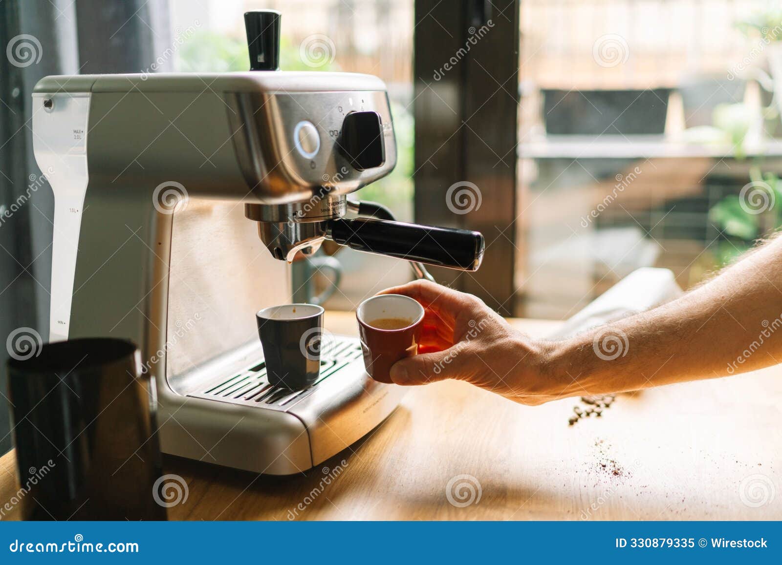 A Person Making Coffee with an Espresso Machine in a Cozy Kitchen ...