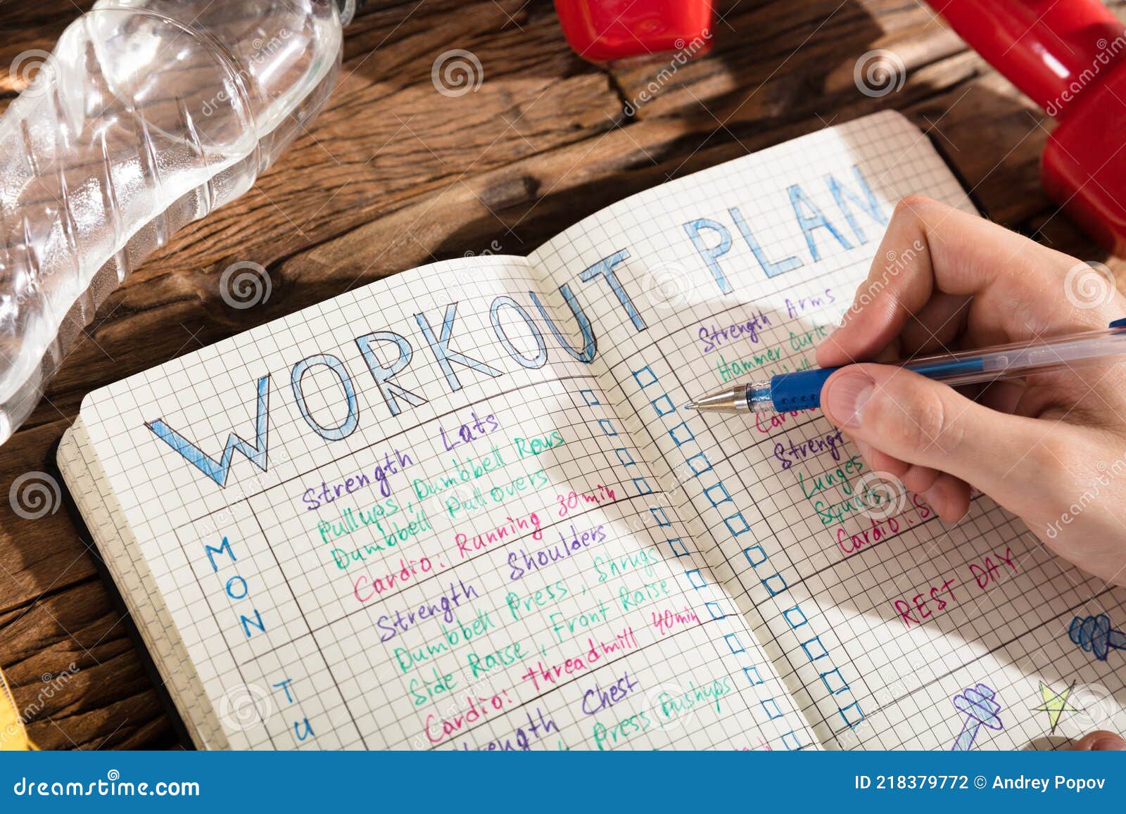 Person Making Note of Workout Plan on Notebook Stock Photo - Image of ...