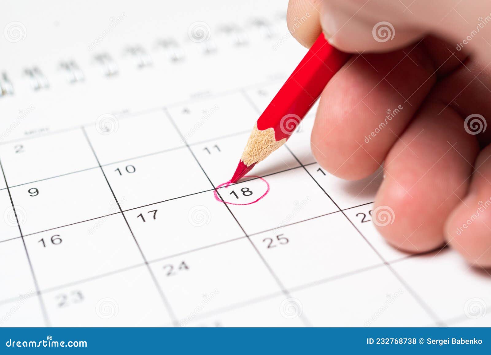 Person Marks the Date on the Calendar with a Red Pencil As a Reminder ...