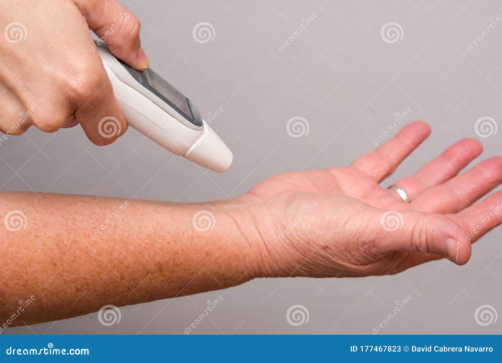 Person Measuring Temperature with Thermometer in Wrist Stock Image ...