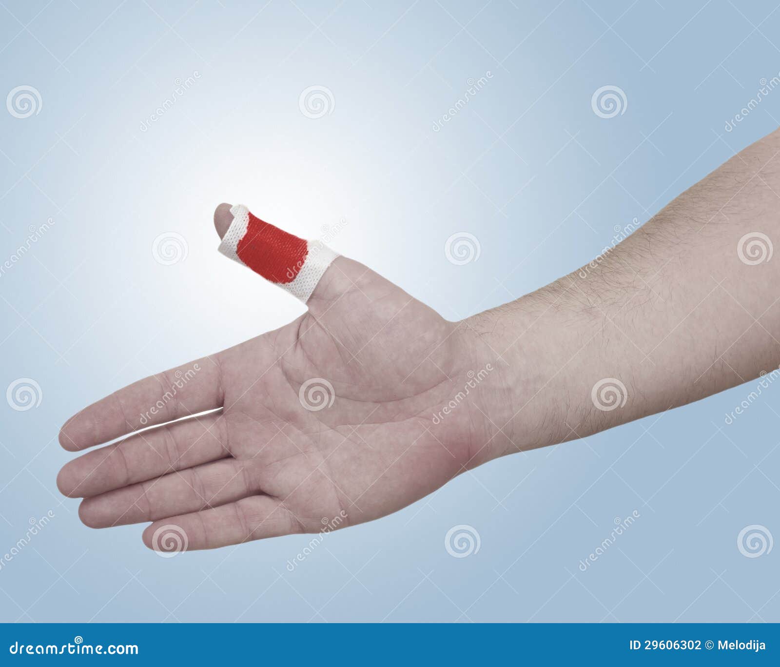 A Person Medically Dressed with a Cotton Ball and Bandage Over a Stock ...