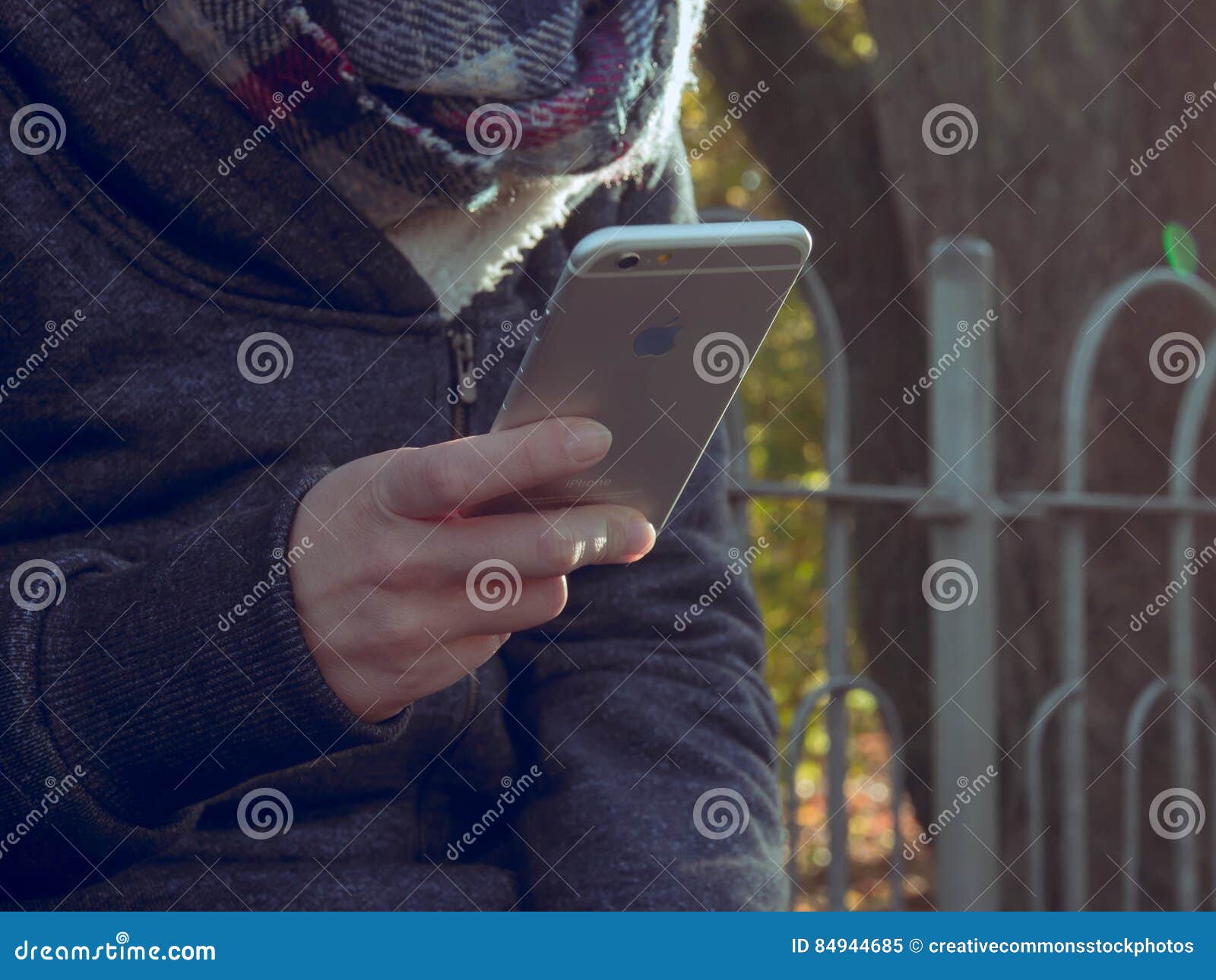 Person With Mobile Phone Outdoors Picture. Image: 84944685